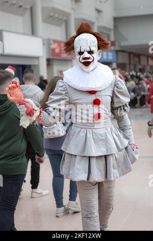People dressed as a Halloween character pose for a photo during the ...