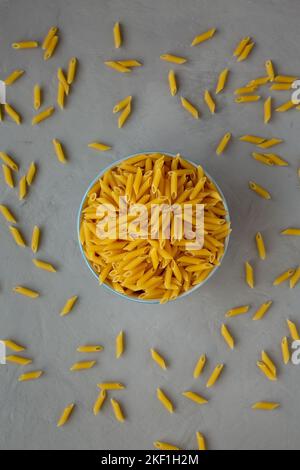 Homemade Raw Dry Mini Penne Pasta background Stock Photo - Alamy