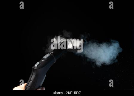 Steam cleaning on black. Home cleaning. Photo with copy space Stock ...