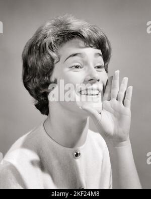 Calling, shouting. Caucasian teen's girl portrait on yellow studio ...
