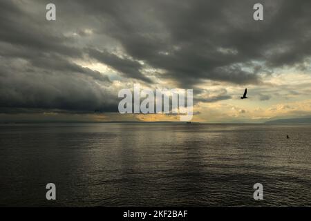 Gloomy clouds are visible over the sea. Changeable weather over Kvarner ...