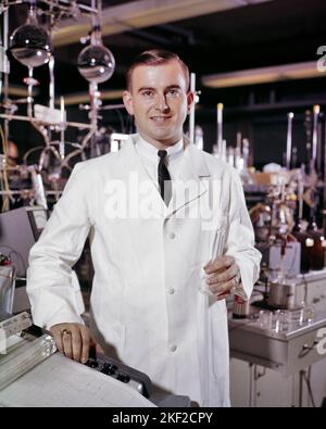 1960s MAN SCIENTIST CONDUCTING EXPERIMENT TEST TUBE LIQUIDS Stock Photo ...