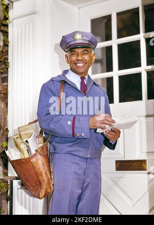 Portrait of a postman Stock Photo - Alamy