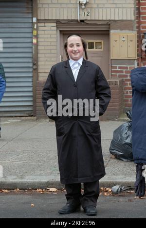 Posed portrait of a hasidic student with long peyot & wearing a ...