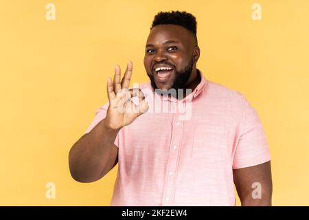 Well done. Handsome bearded man showing thumb up, praising good work ...