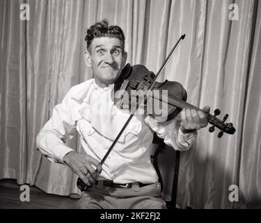Man playing fiddle Stock Photo - Alamy