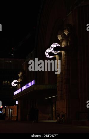 Lantern Carriers Helsinki wearing masks Stock Photo - Alamy