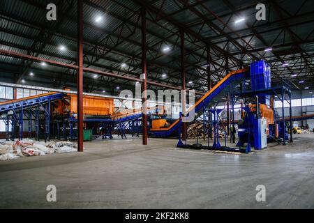 Modern waste processing plant. Sorting, pressing and packing of garbage ...