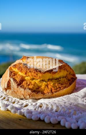 Portugeese homemade oven baked yellow corn bread served outdoor with ...