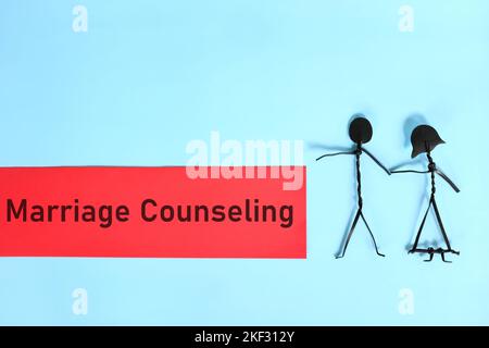 Marriage counseling concept. Couple stick figure on blue background ...