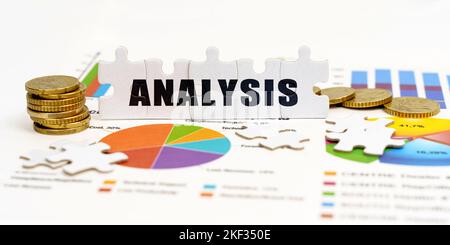 Business and Economics. There are coins and puzzles on financial charts ...