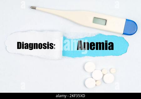 The diagnosis concept - anemia. Sheet with the word anemia on the ...