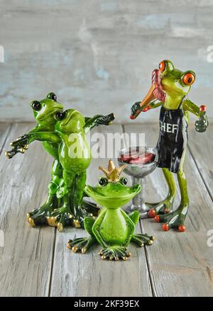 Set of ceramic frogs on wooden background Stock Photo - Alamy