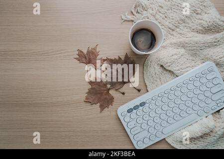 Top view of the desktop. Scarf glasses keyboard marshmallow envelope ...