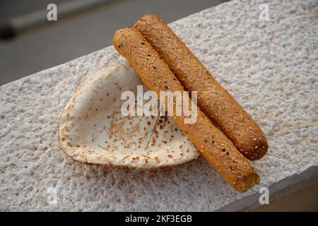 Jordanian flat bread and seeded bread sticks. Middle Eastern staple ...