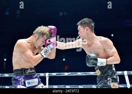Champion Shuichiro Yoshino (purple gloves) and challenger Masayoshi Nakatani (black gloves ...