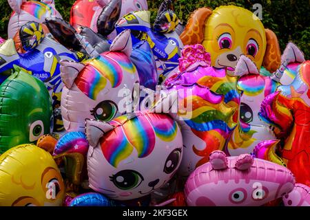Helium filled cartoon characters balloons Stock Photo - Alamy