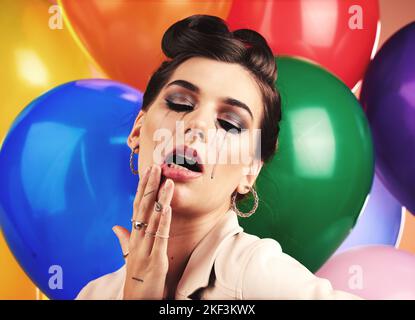 Party balloon and makeup woman crying with sad, depressed and ...