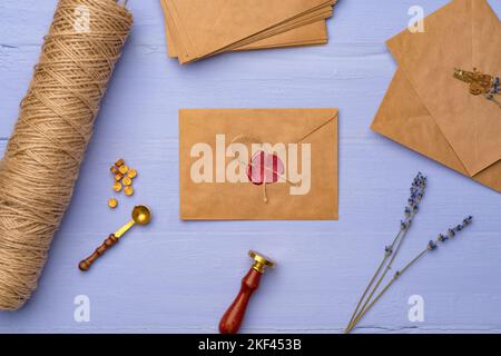 Handmade paper envelope on lavender wooden table Stock Photo - Alamy