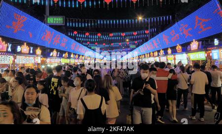 The crowds at the night market near the Harbin Normal University in ...