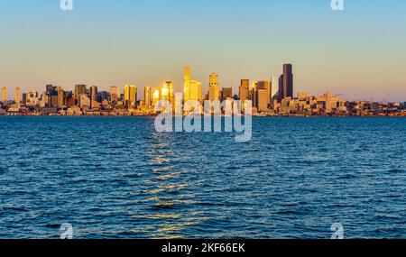 Sunlight reflects from buildings of the Seattle skyline in Washington ...