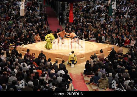 A high angle shot sumo wrestlers compete in a championship in Fukuoka ...