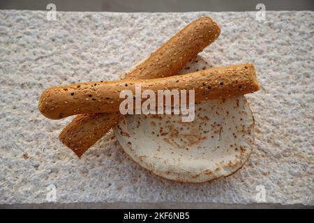 Jordanian flat bread and seeded bread sticks. Middle Eastern staple ...