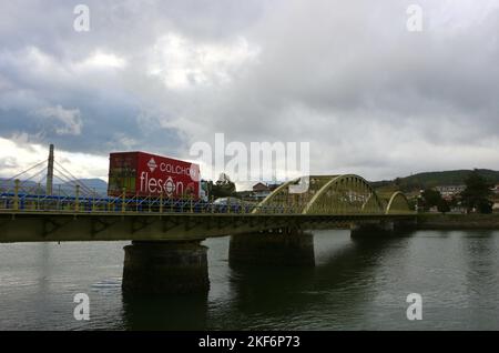 The steel swing bridge and bowstring-arch-truss bridge and road signs ...