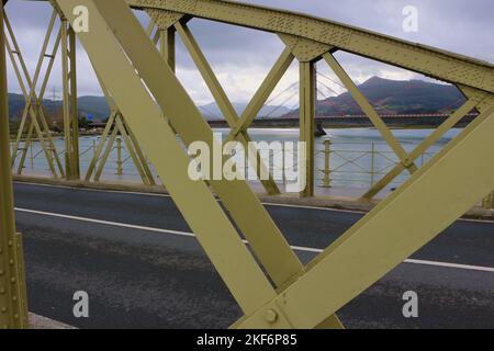 The steel swing bridge and bowstring-arch-truss bridge and road signs ...