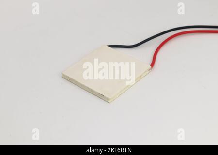 Top view of the Peltier temperature sensor with circular red and black ...