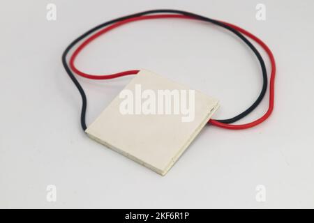 Top view of the Peltier temperature sensor with red and black wires ...
