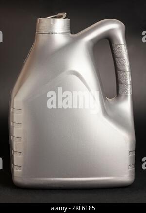 Motor oil canister on grey background Stock Photo - Alamy
