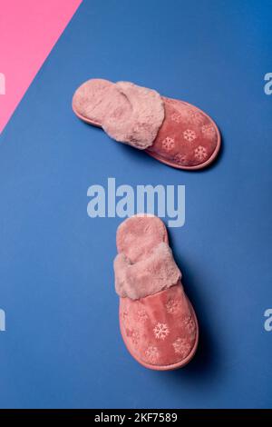 Pink warm women's slippers on a white background Stock Photo - Alamy