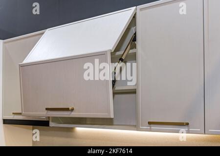 Electric Powered Automatic Cabinet Door Opener in Modern Kitchen Stock ...