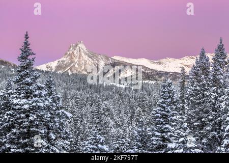 pre-dawn sky over ross peak in the bridger range in winter near bozeman ...