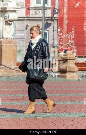 Timisoara, Romania - March 15, 2018: Woman walking on the street. Real ...