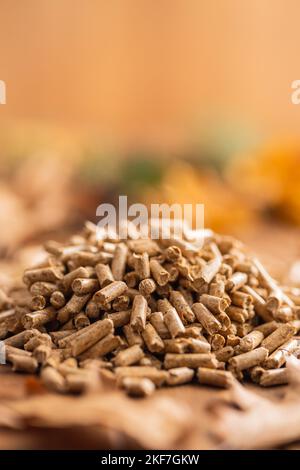 Pile of wood pellets on table outdoors Stock Photo - Alamy