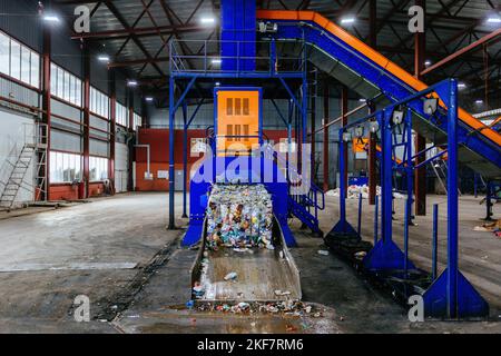 Modern waste processing plant. Sorting, pressing and packing of garbage ...