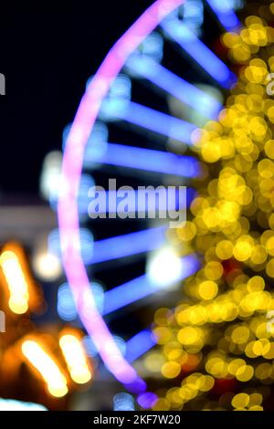 Ferris wheel decorated blue illumination, Christmas tree, black ...