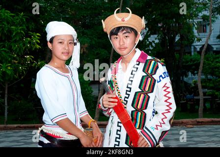 Ethnic Kachin male in traditional attire wear traditional rattan hats ...