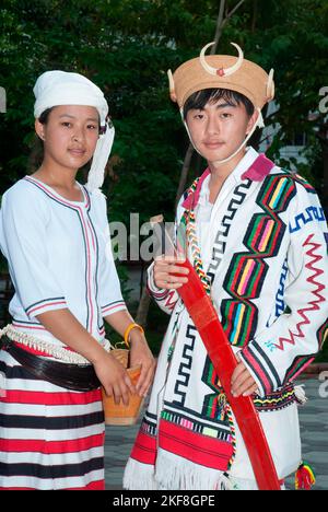 Ethnic Kachin male in traditional attire wear traditional rattan hats ...