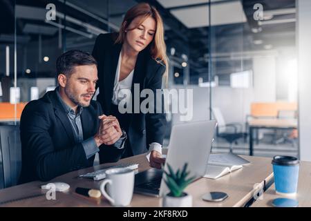 Busy coworkers cooperating and working together at office meeting ...