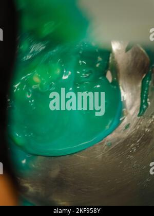 melting piping bag light blue turquoise green filling to drip a frosted ...