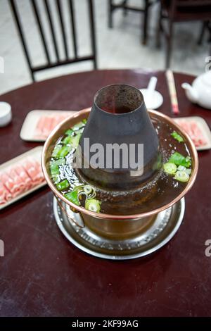 Traditional and delicious old Beijing copper pot mutton Stock Photo - Alamy
