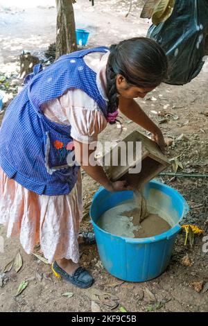 Making red clay pottery. The potter shapes red clay by hand to make a ...