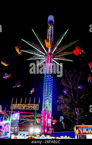 People Enjoying Fast Spinning Amusement Rides at The Royal Melbourne ...