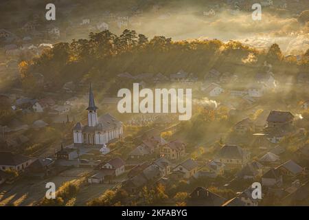 Dramatic autumn morning above the Ieud village in the historical region ...