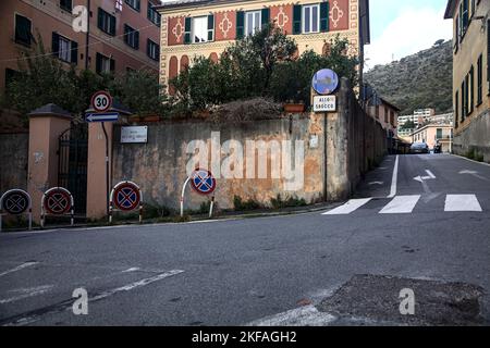 Narrow up hill street next to a wall on a cloudy day Stock Photo - Alamy