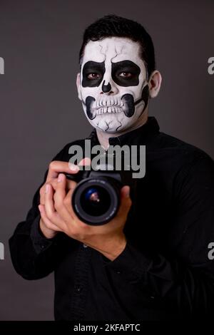 man in catrin or skull makeup for day of the dead as mexican tradition ...