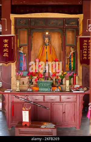 Altar shrine with Taoist imagery in a temple building encountered when ...